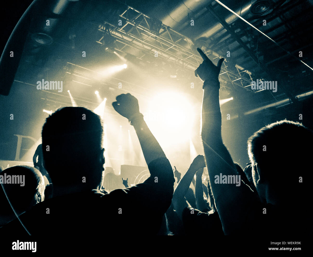 Colourful concert hall with clapping people Stock Photo - Alamy