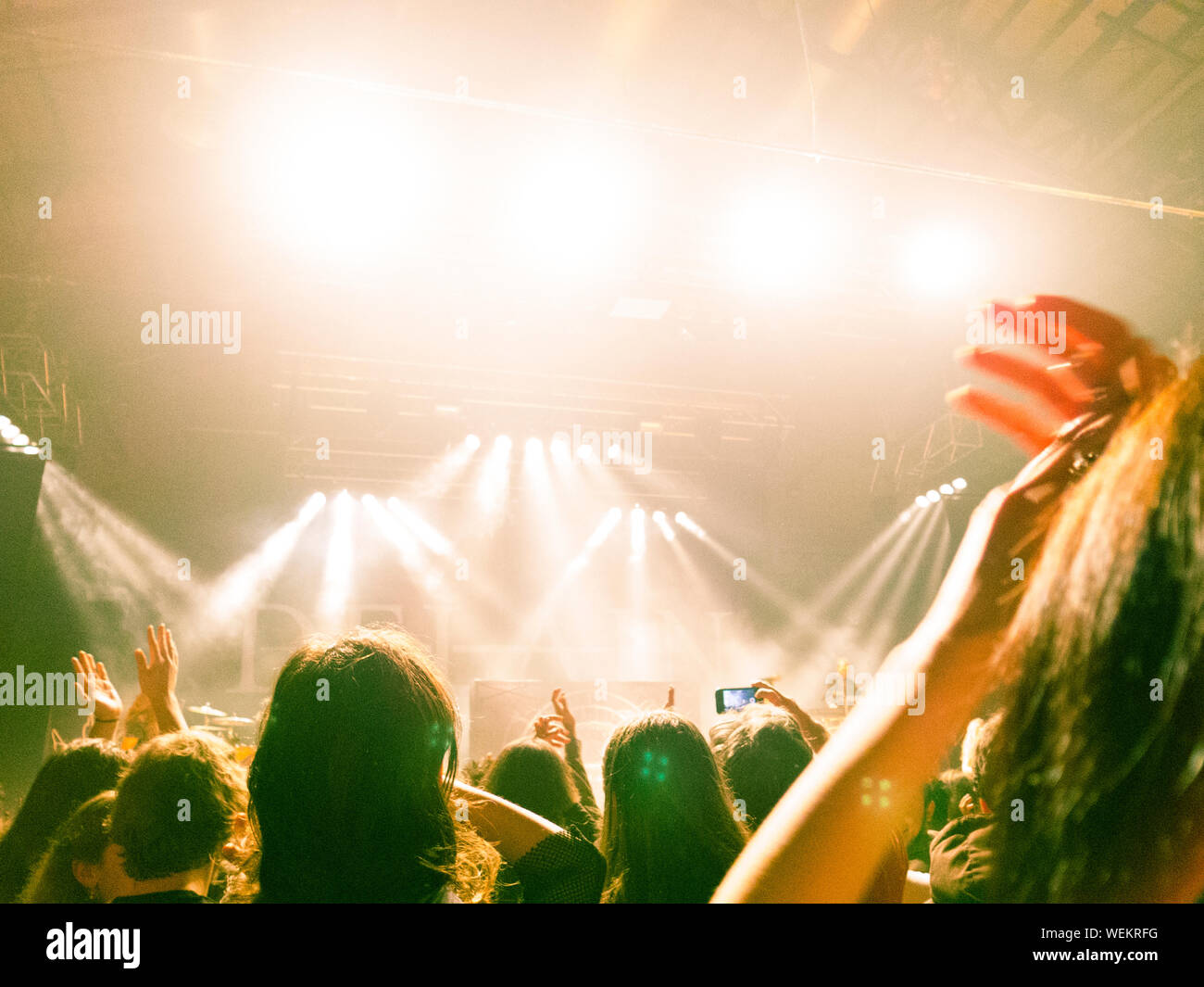 Colourful concert hall with clapping people Stock Photo - Alamy