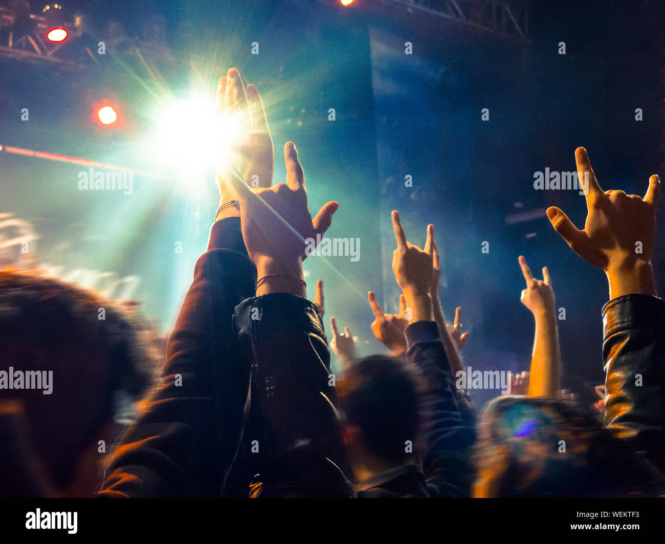 Colourful concert hall with clapping people Stock Photo - Alamy