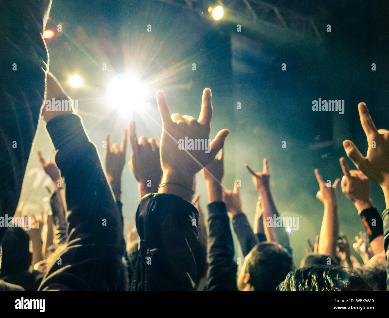 Colourful concert hall with clapping people Stock Photo - Alamy