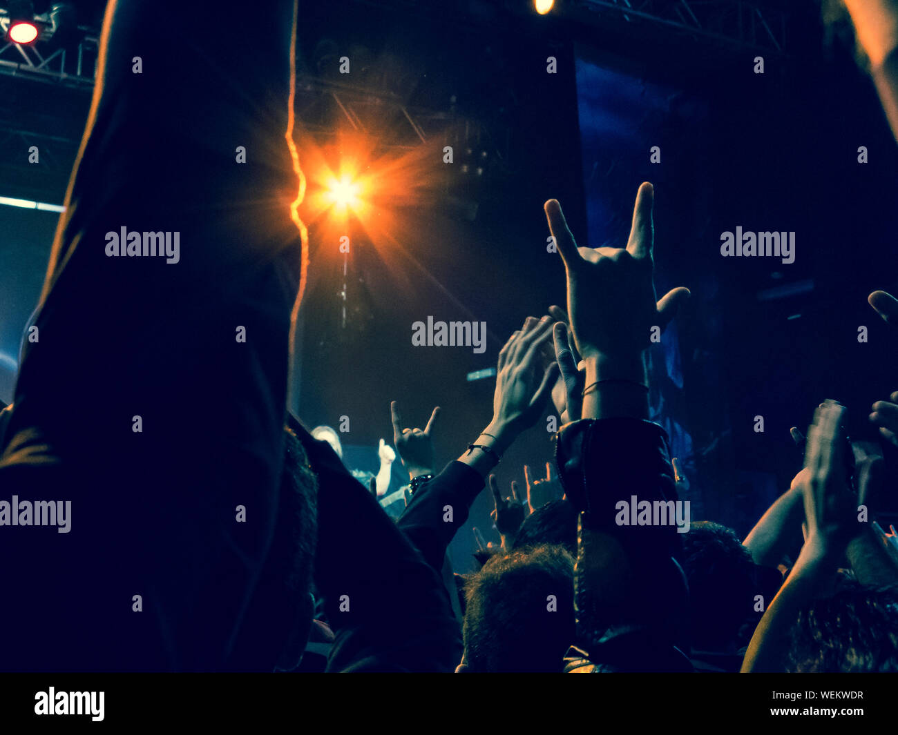 Colourful concert hall with clapping people Stock Photo - Alamy