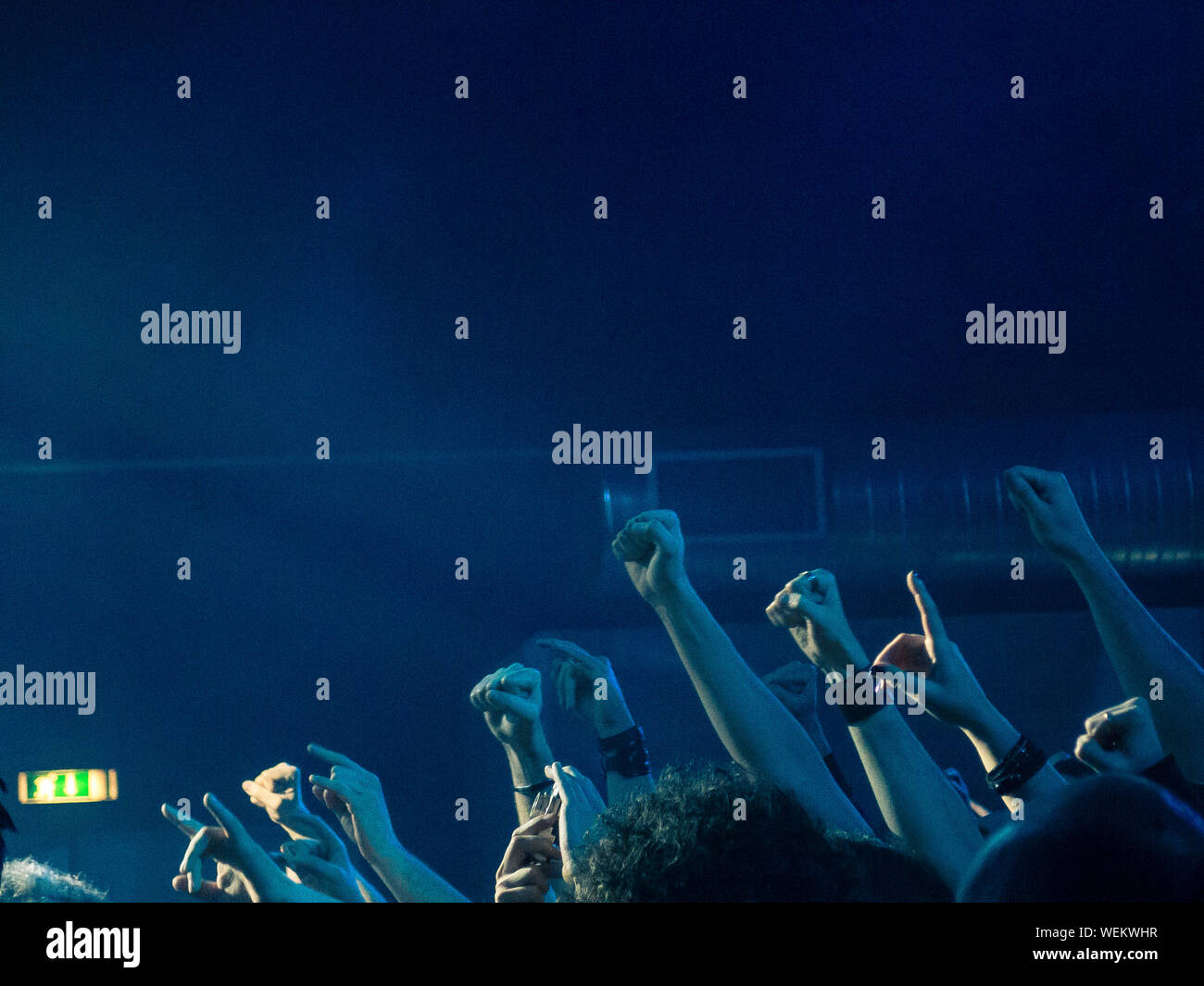 Colourful concert hall with clapping people Stock Photo - Alamy