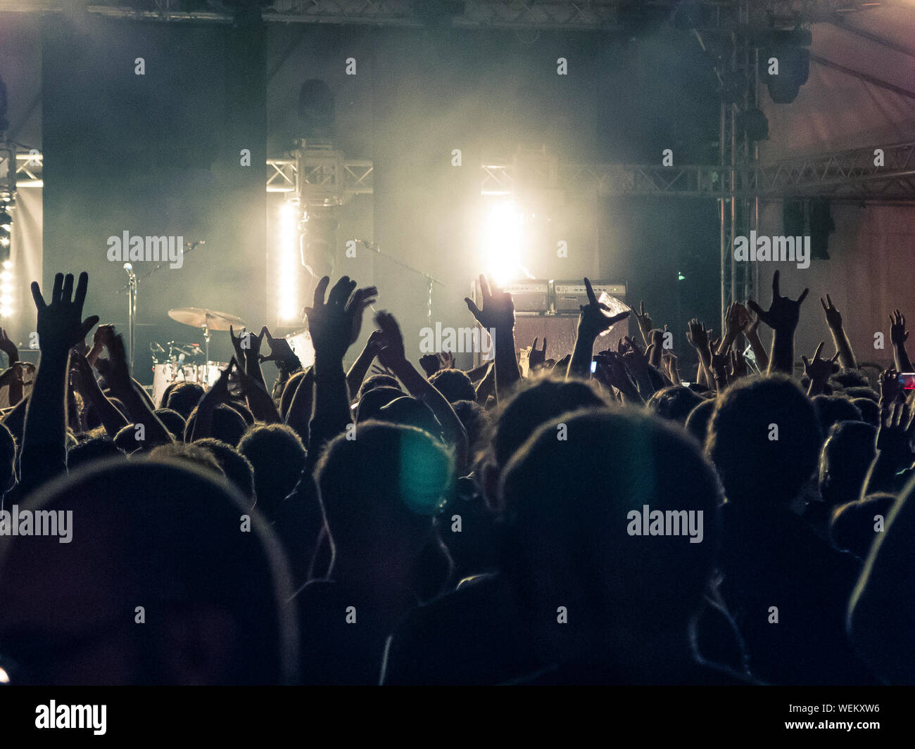Colourful concert hall with clapping people Stock Photo - Alamy