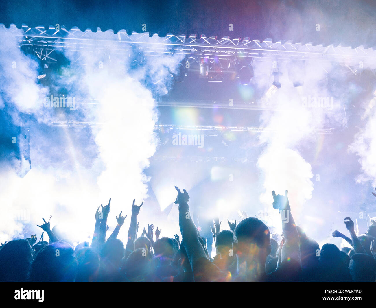 Colourful concert hall with clapping people Stock Photo - Alamy