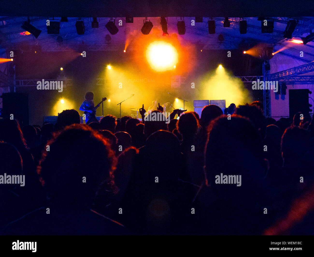 Colourful concert hall with clapping people Stock Photo - Alamy