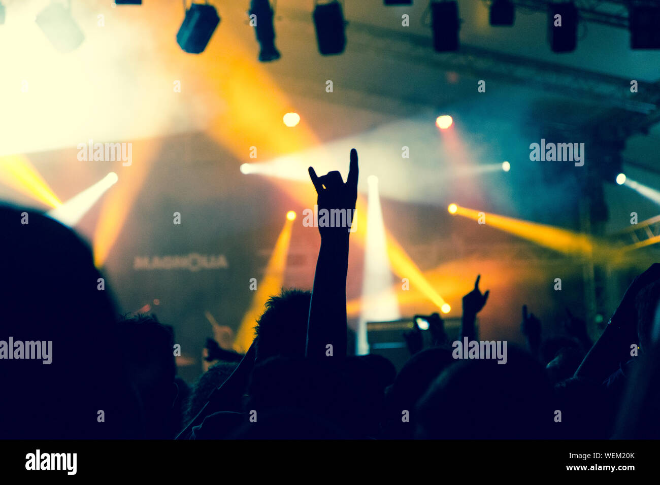 Colourful concert hall with clapping people Stock Photo - Alamy