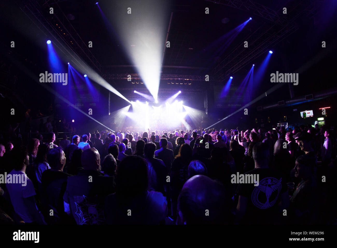 Colourful concert hall with clapping people Stock Photo - Alamy