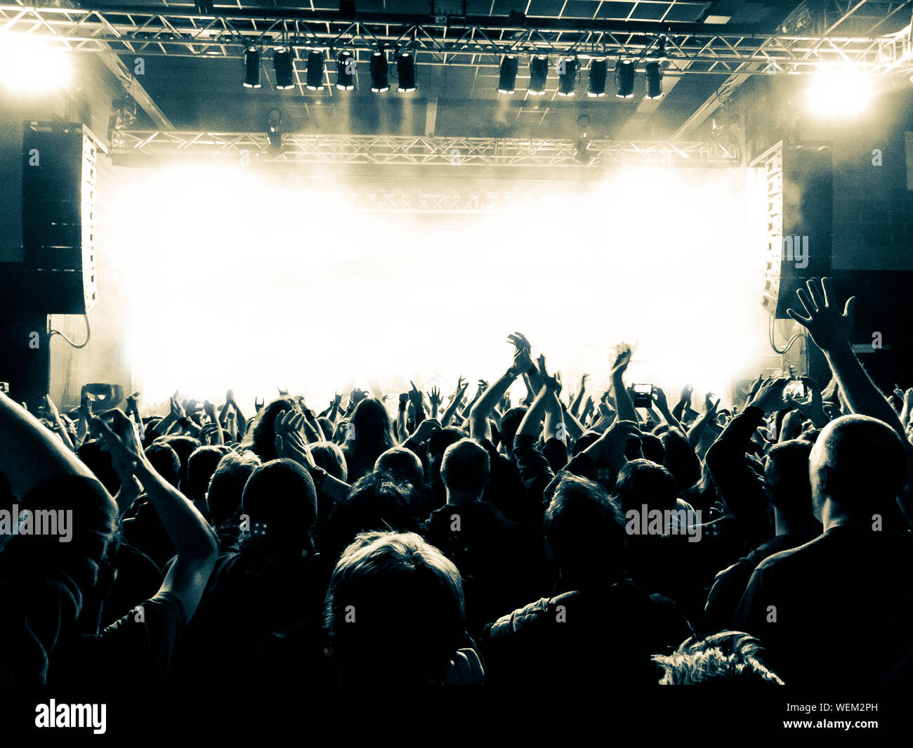 Colourful concert hall with clapping people Stock Photo - Alamy