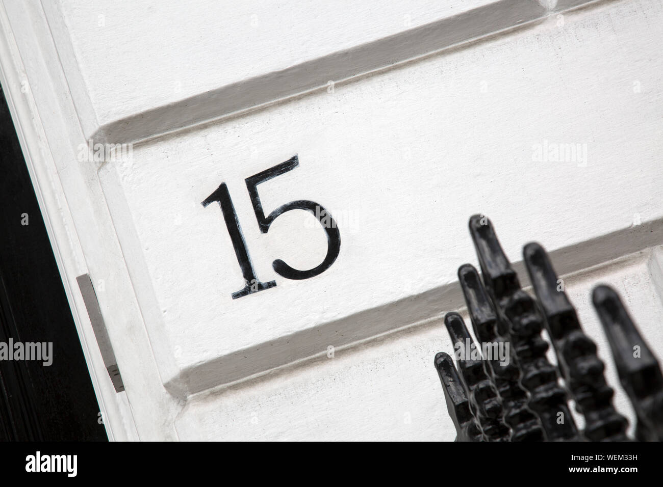 Closeup of Number Fifteen on White Wall with Diagonal Slant Stock Photo ...