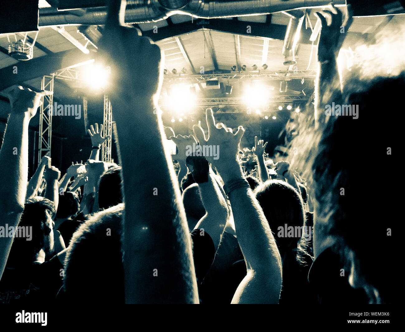 Colourful concert hall with clapping people Stock Photo - Alamy