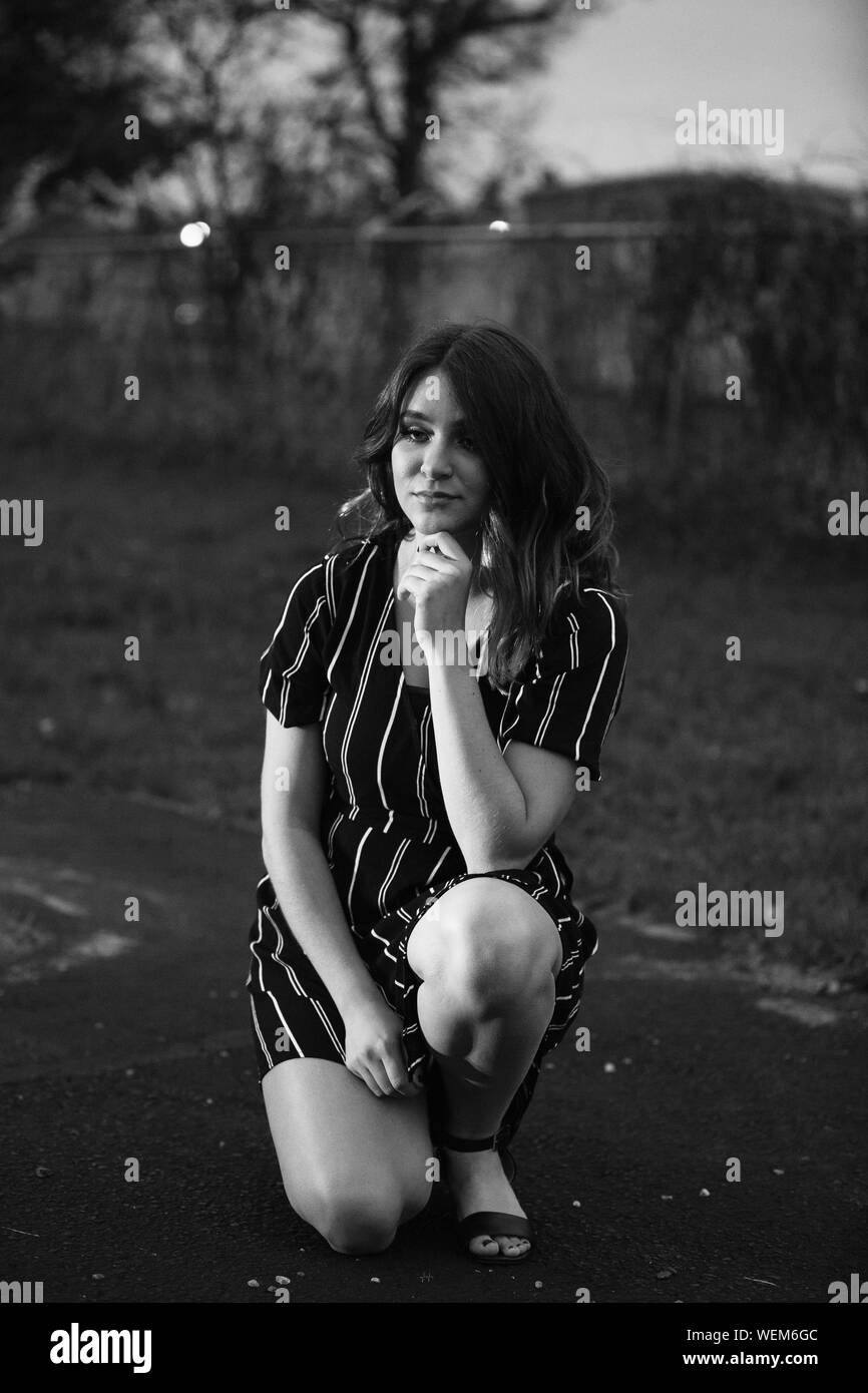 Crouching dress Black and White Stock Photos & Images - Alamy