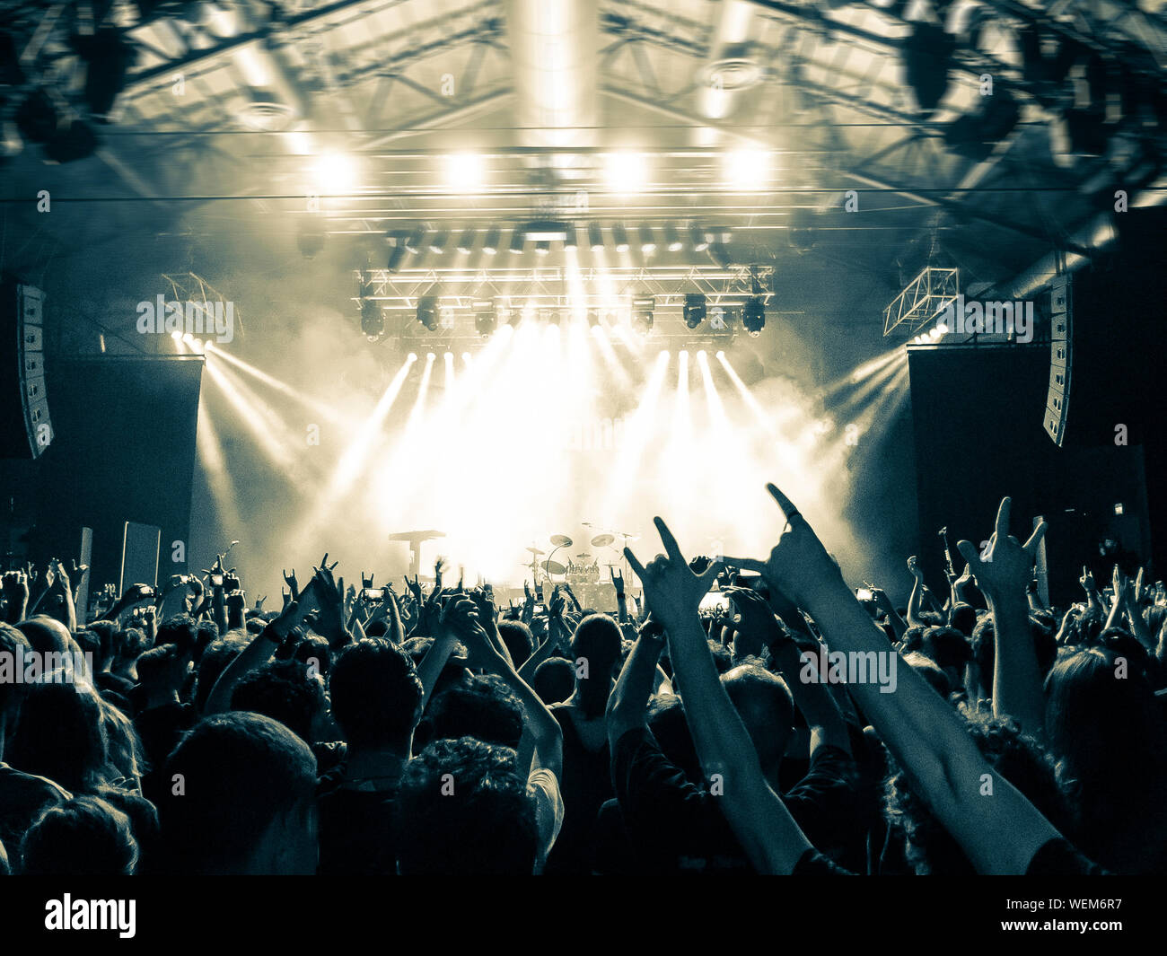 Colourful concert hall with clapping people Stock Photo - Alamy