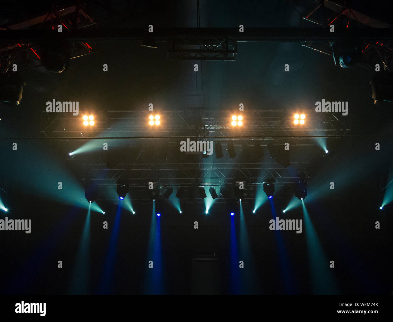 Colourful concert hall with clapping people Stock Photo - Alamy