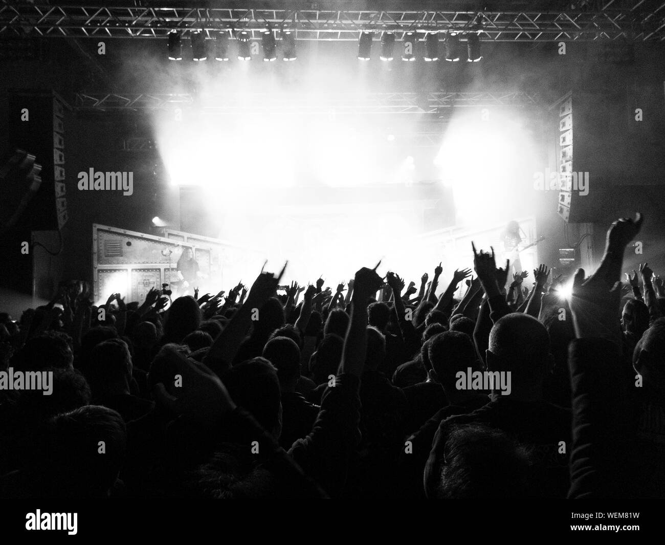 Colourful concert hall with clapping people Stock Photo - Alamy