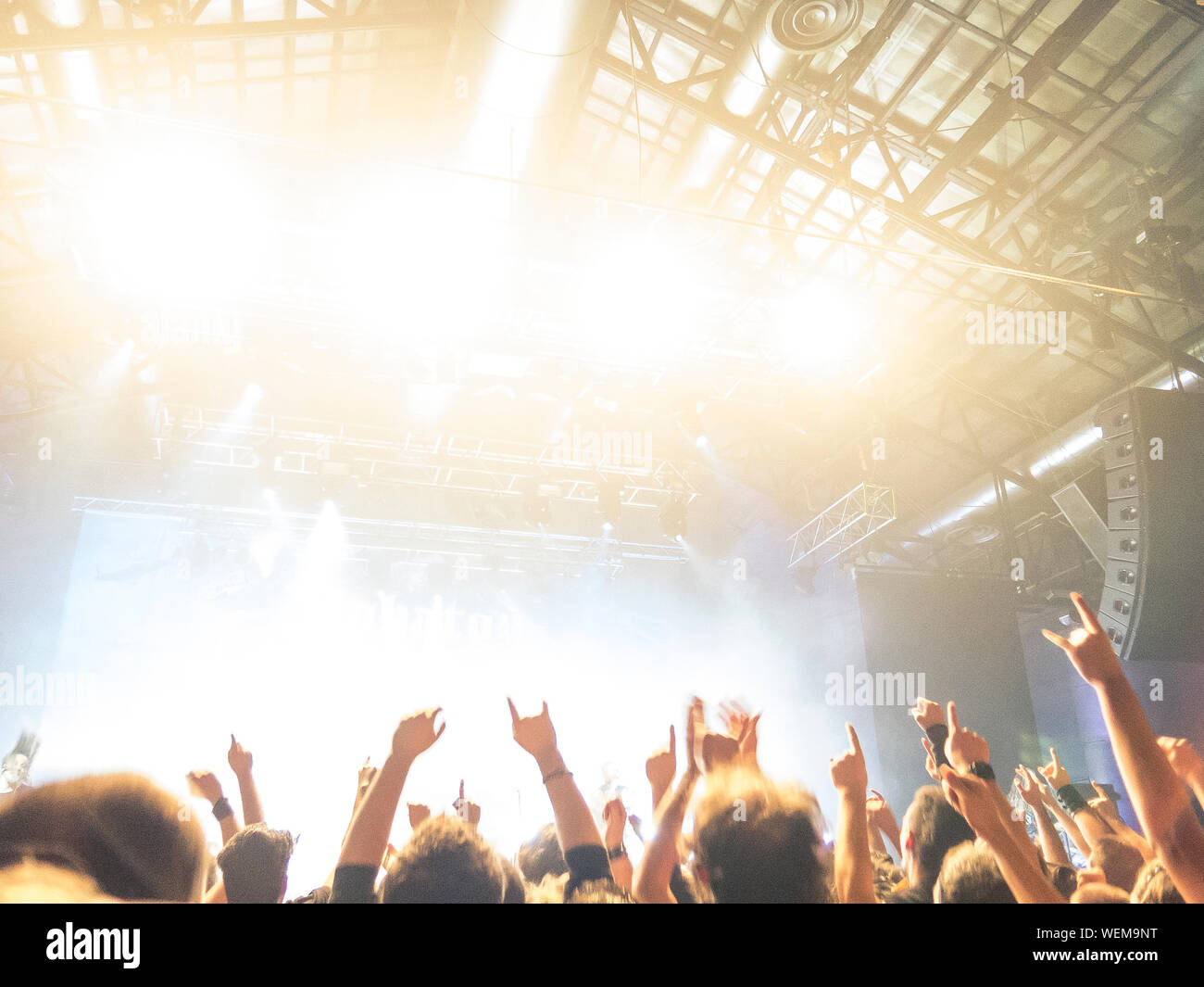 Colourful concert hall with clapping people Stock Photo - Alamy