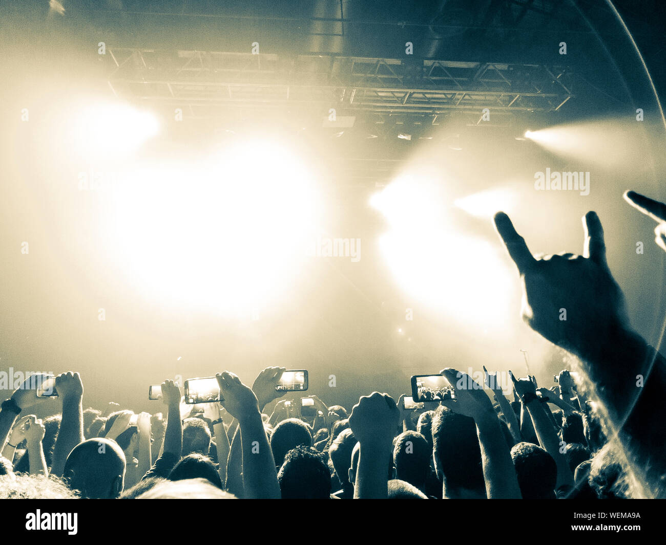 Colourful concert hall with clapping people Stock Photo - Alamy