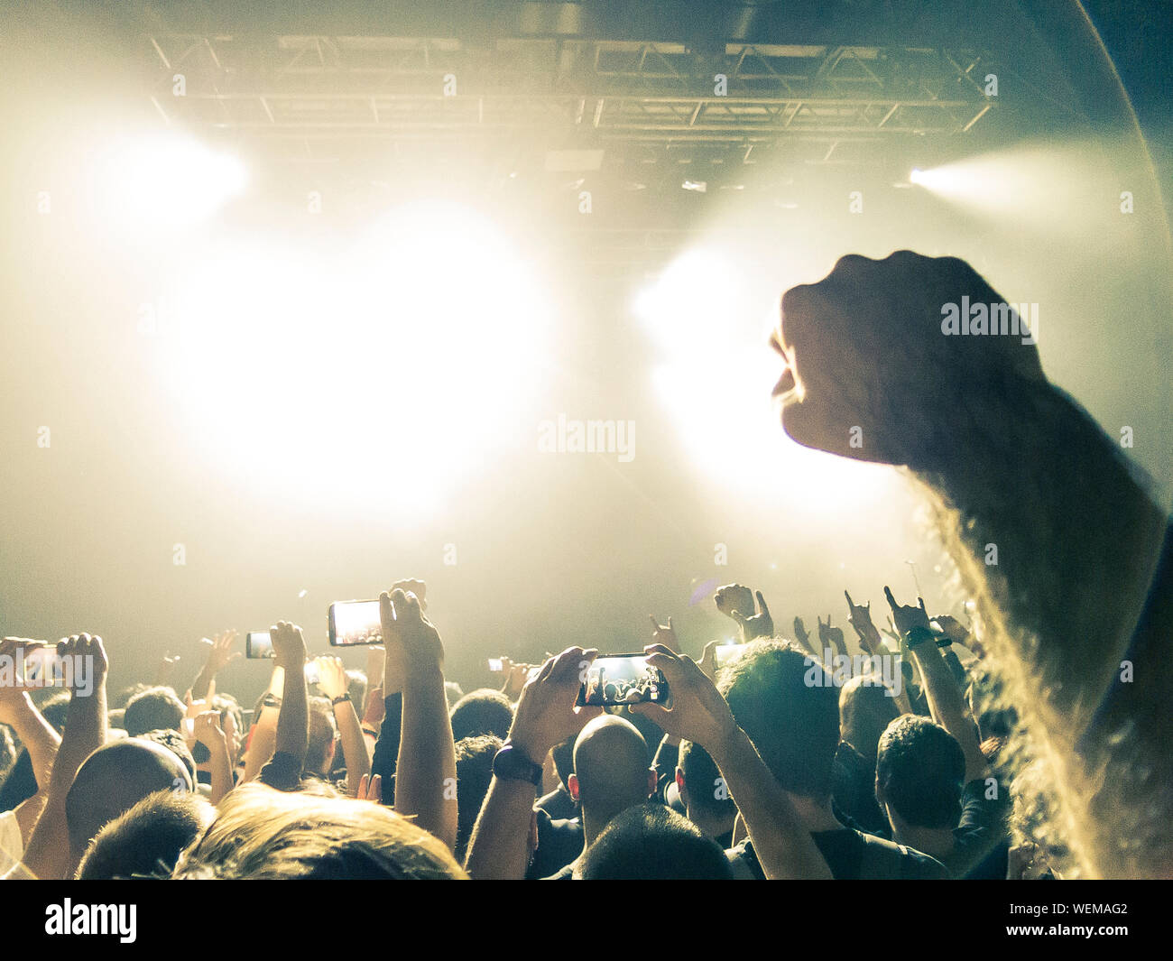 Colourful concert hall with clapping people Stock Photo - Alamy