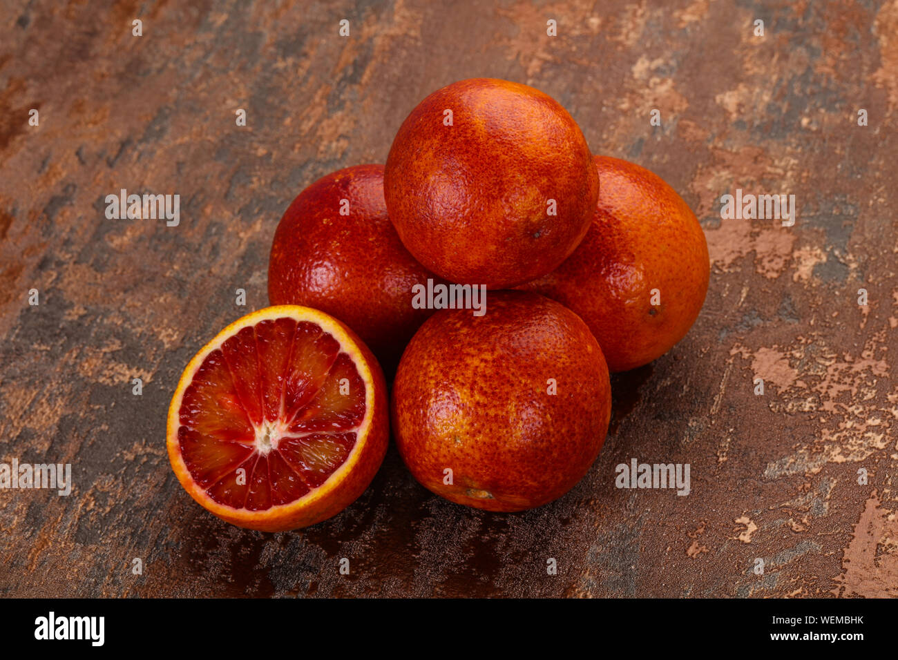 Sweet red orange heap over the table Stock Photo - Alamy
