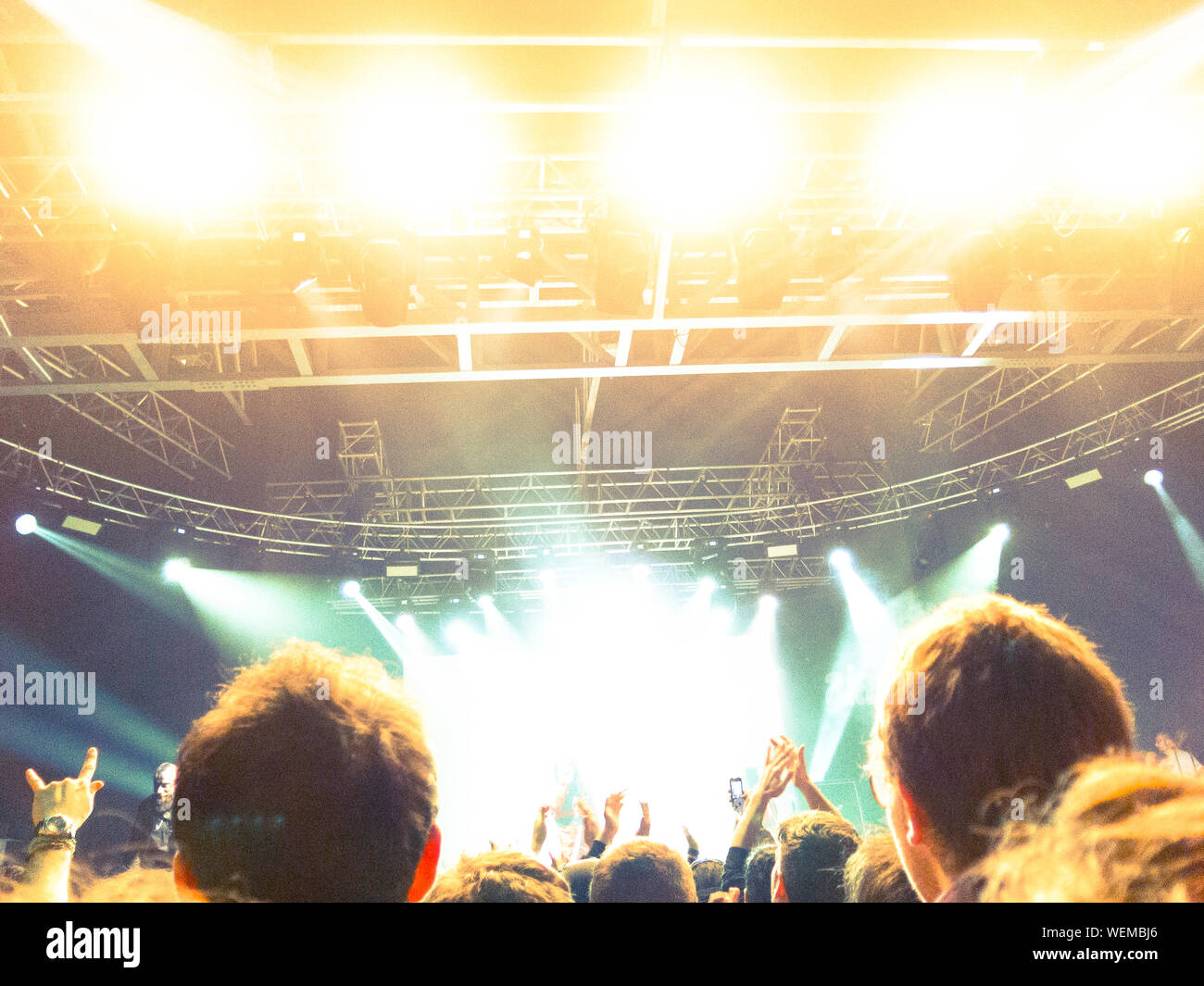 Colourful concert hall with clapping people Stock Photo - Alamy