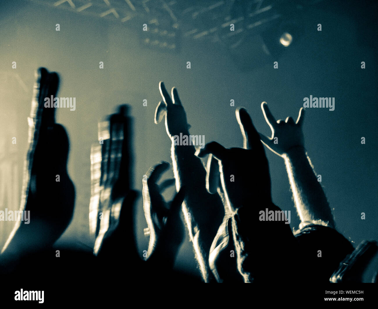 Colourful concert hall with clapping people Stock Photo - Alamy
