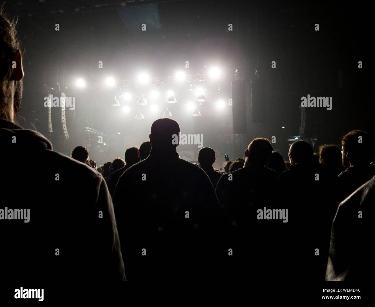 Colourful concert hall with clapping people Stock Photo - Alamy