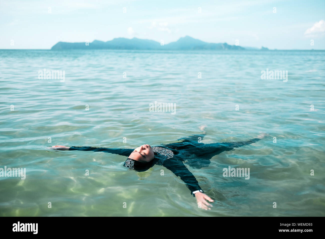 Floating on the water woman lake hi-res stock photography and images ...