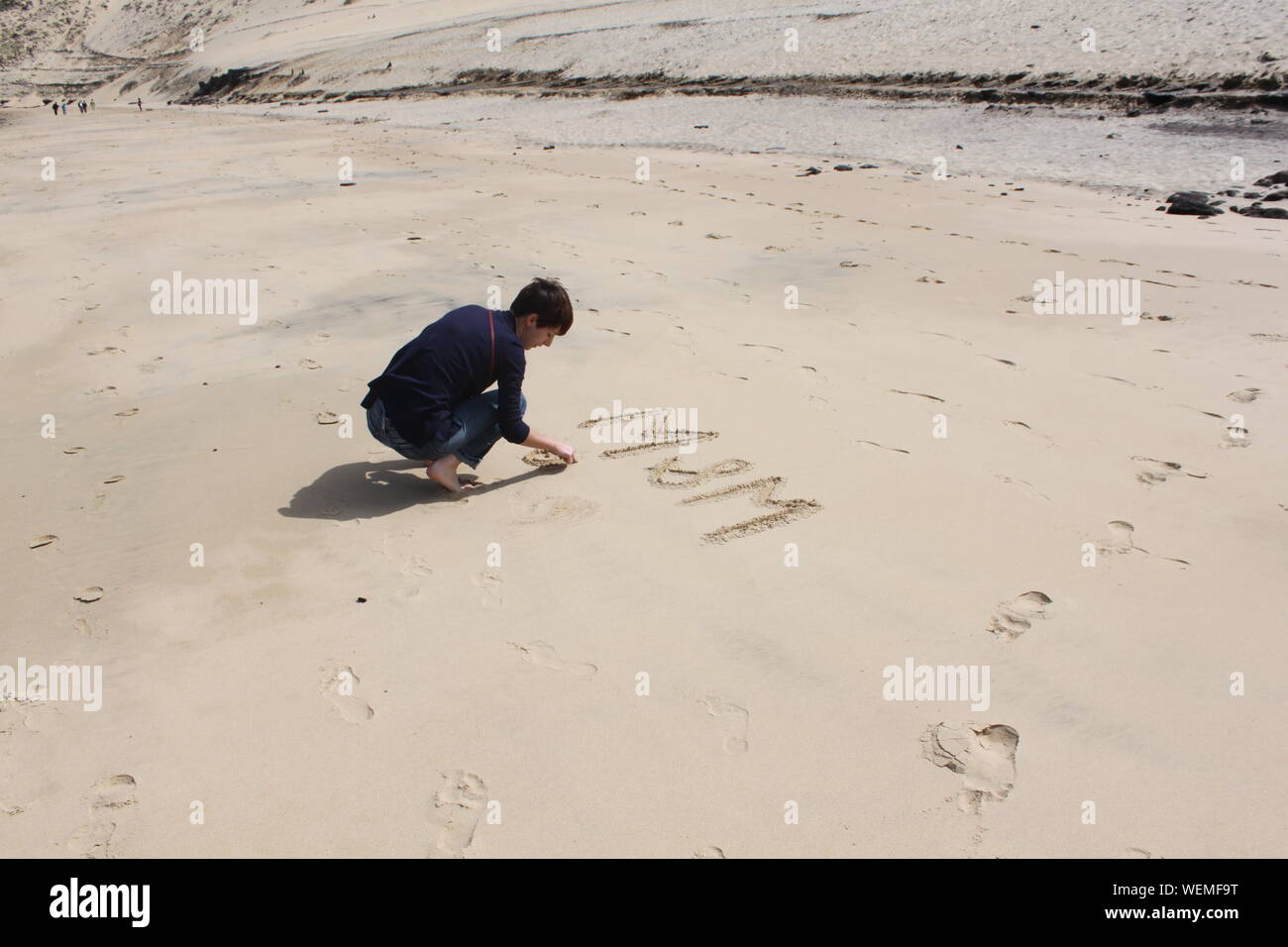 Writing in sand hi-res stock photography and images - Alamy