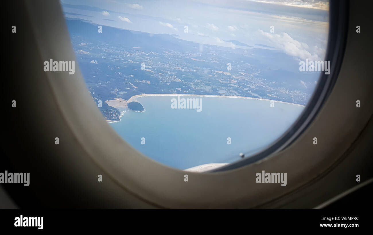 Beautiful scenic ocean view of sunset through the airplane window Stock ...