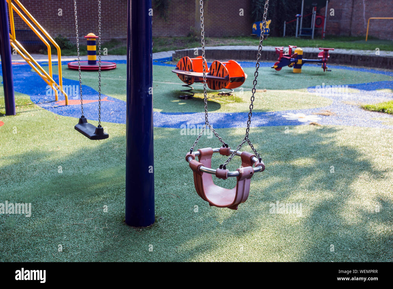 Empty children playground with swingset colorful in the city Stock ...