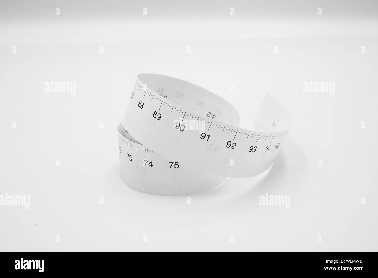 White measuring tape ruler metric measurement or diet concept isolated ...