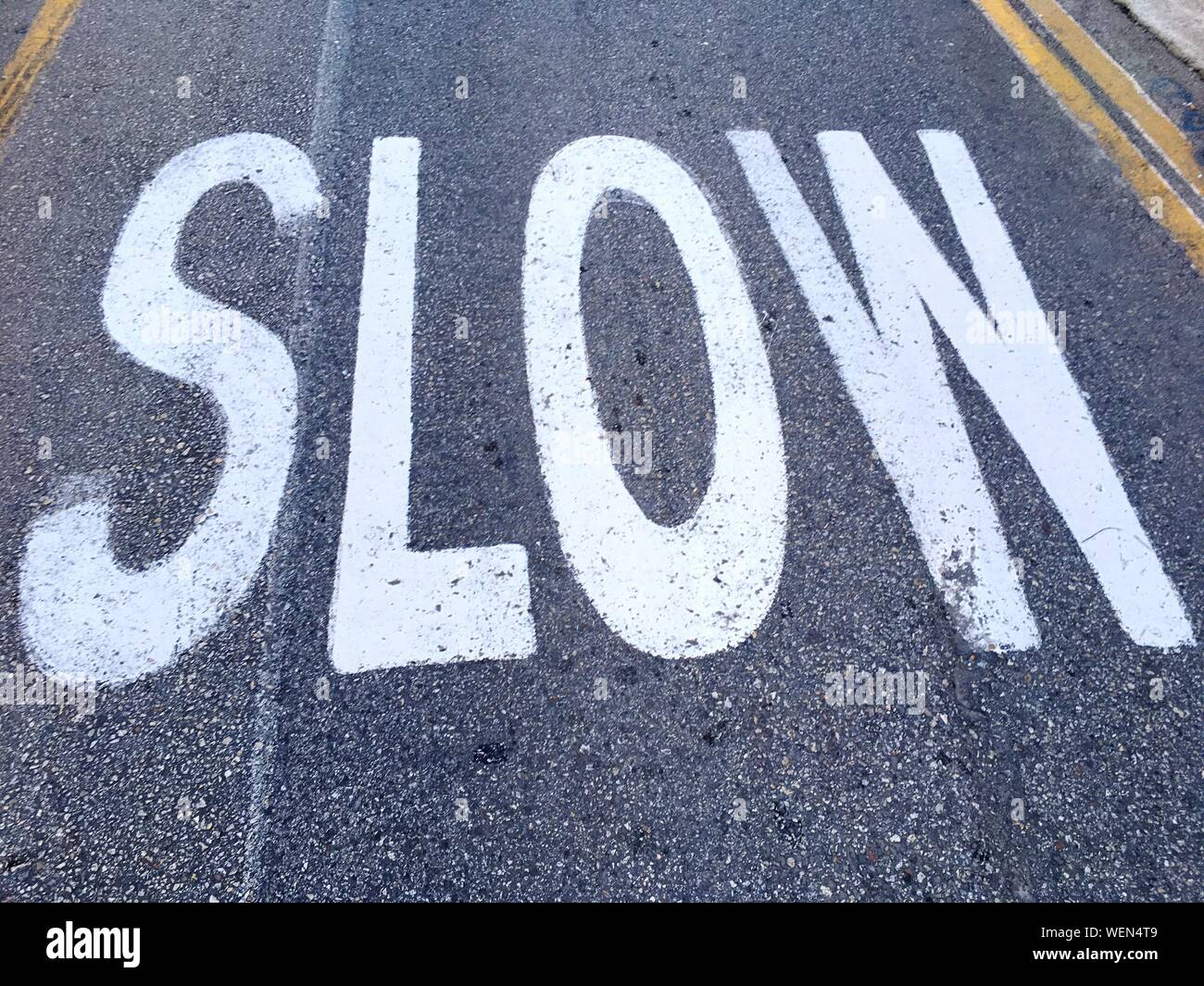 Road marking slow hi-res stock photography and images - Alamy