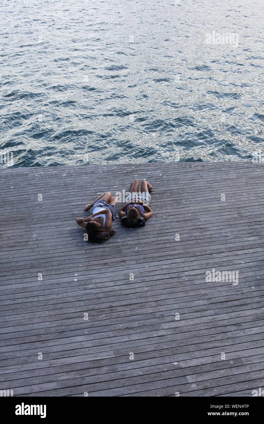 Two sunbathing women hi-res stock photography and images - Alamy