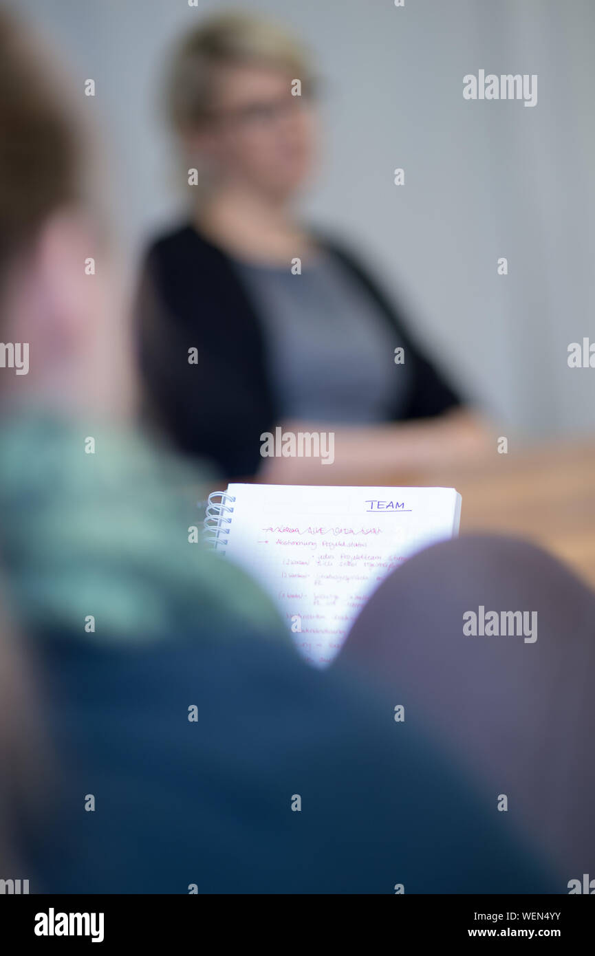 Women With Notepad In Meeting At Conference Room Stock Photo - Alamy