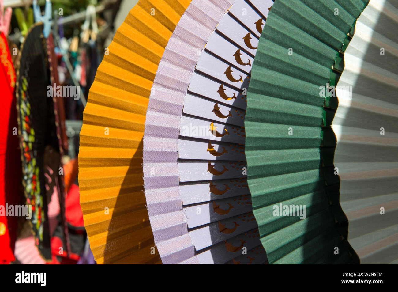 Paper fans open on display at spanish market Stock Photo - Alamy