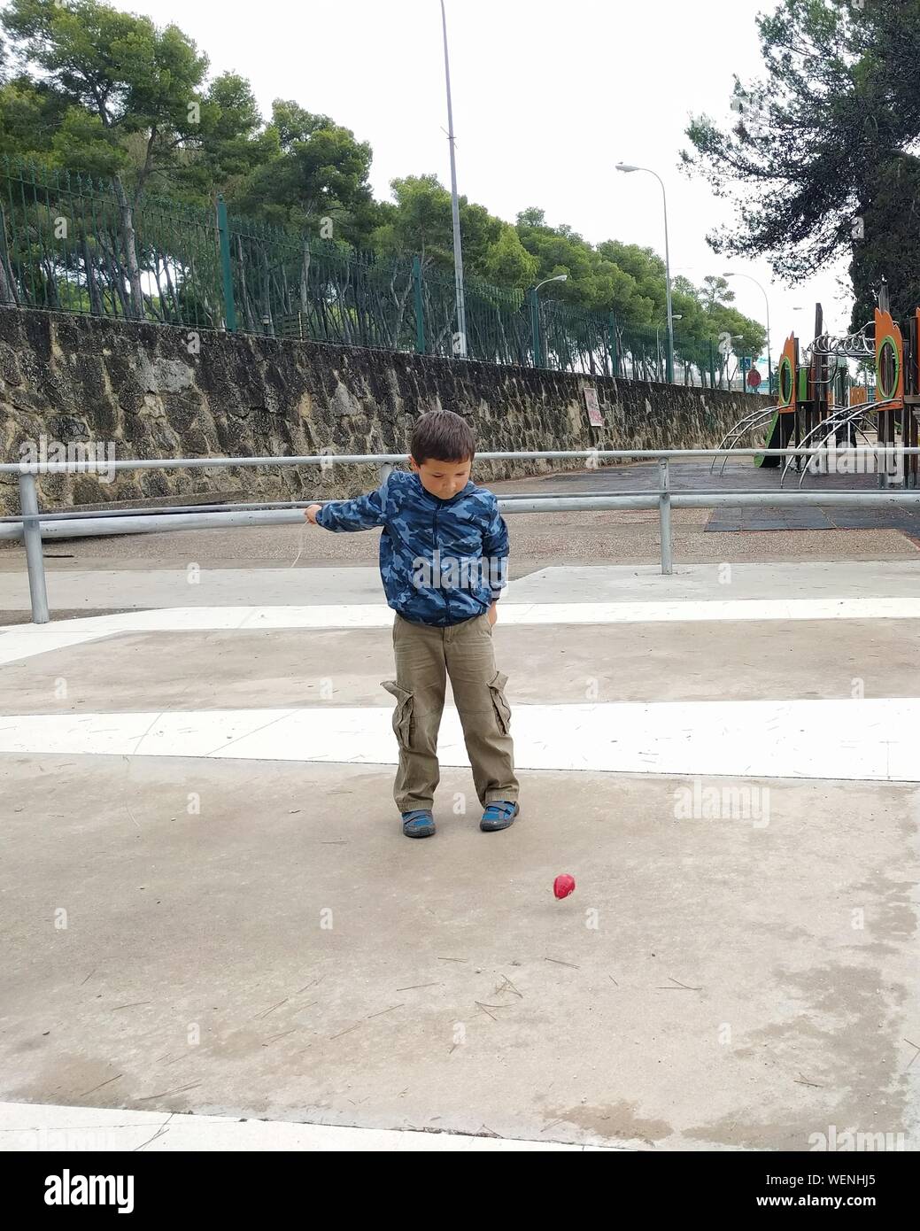 Boy playing spinning top hi-res stock photography and images - Alamy