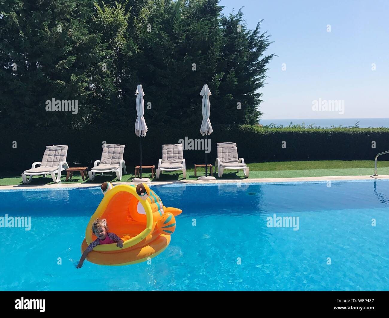 Girl Floating In Inflatable Raft High Resolution Stock Photography and ...