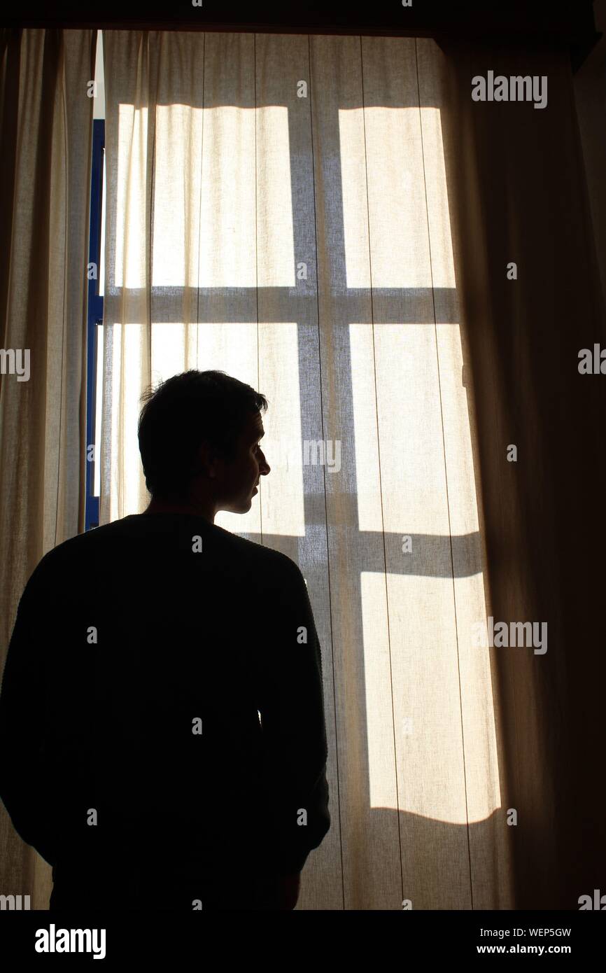 Man hanging curtain hi-res stock photography and images - Alamy