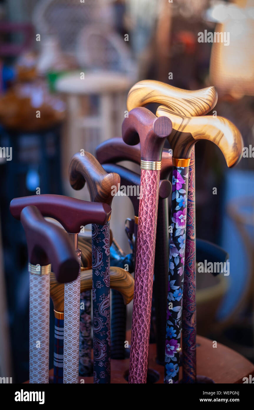 traditional handles of wooden canes in a special stand close-up Stock ...