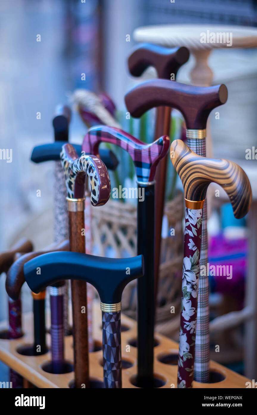 traditional handles of wooden canes in a special stand close-up Stock ...