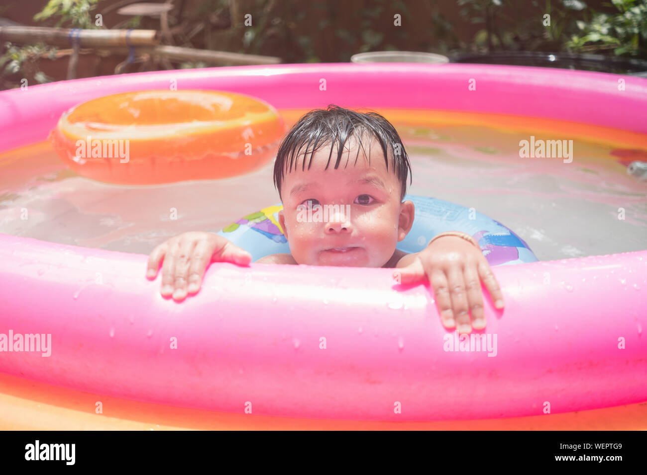 Boy wading into water hi-res stock photography and images - Alamy