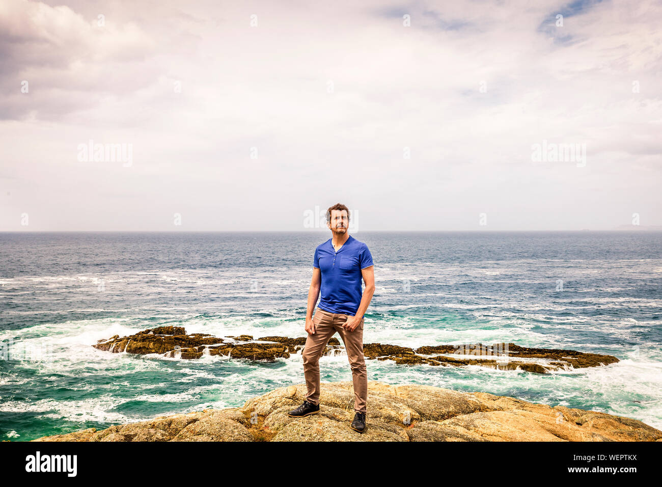 Man thinking on the rocks hi-res stock photography and images - Alamy