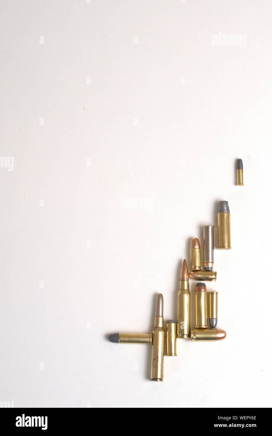 Collage of bullets of different calibers on a white background. There ...