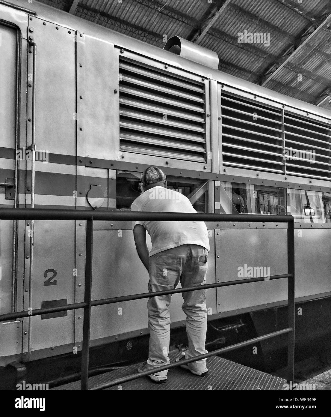 Man Looking Through Train Window Black and White Stock Photos & Images ...