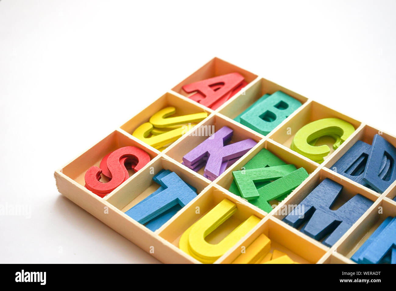 Close-up Of Alphabets In Wooden Container Over White Background Stock ...