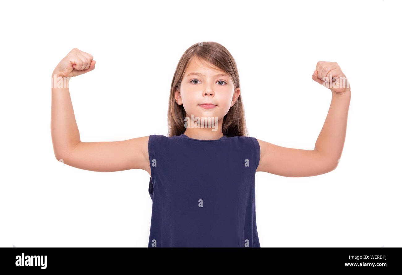 Little girl shows strength tensing muscles on white background Stock ...