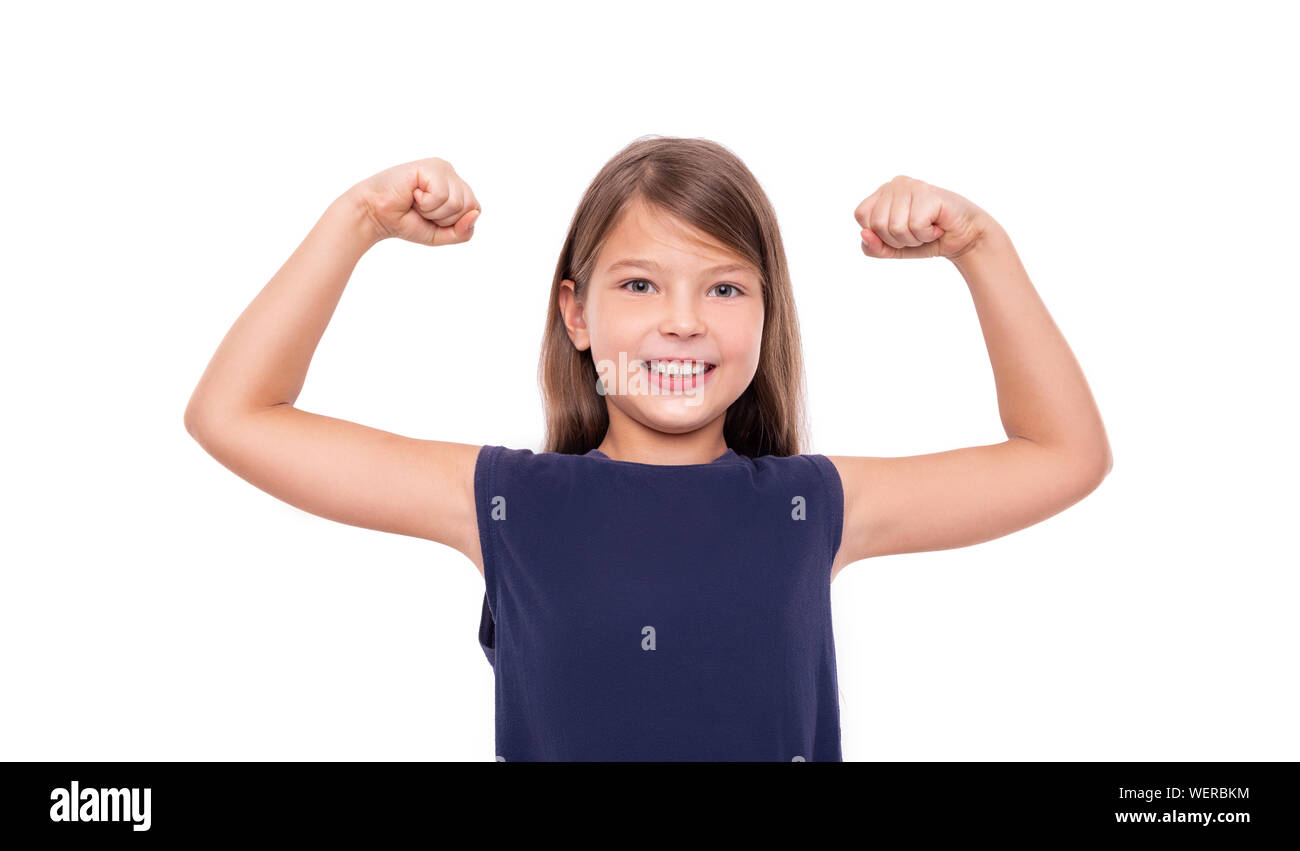 Little girl shows strength tensing muscles on white background Stock ...