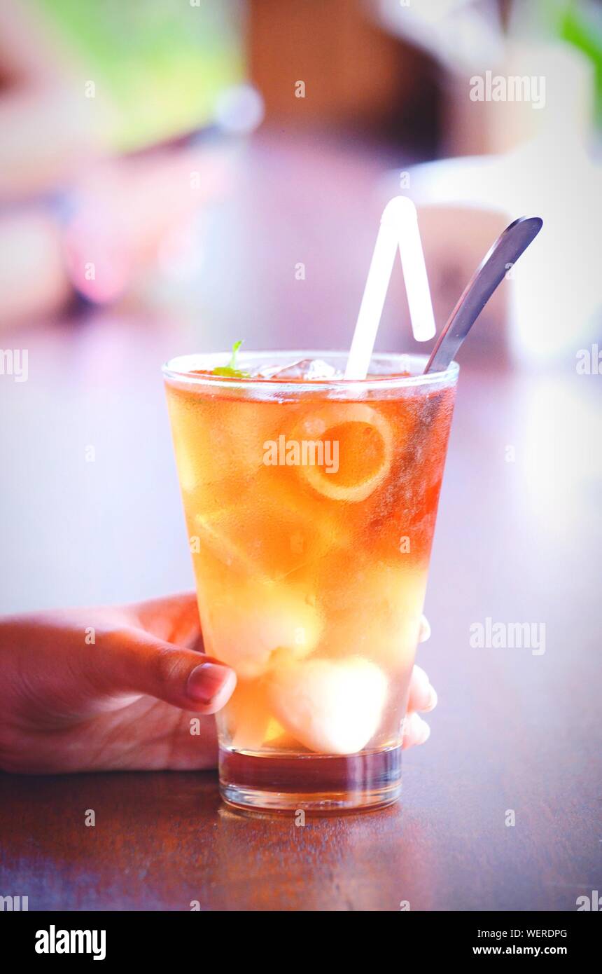 Woman with cocktail in hand hi-res stock photography and images - Alamy