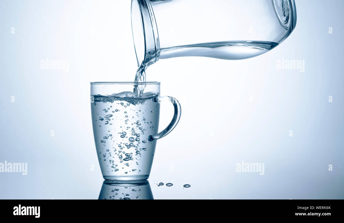 Pouring water from jug hi-res stock photography and images - Alamy