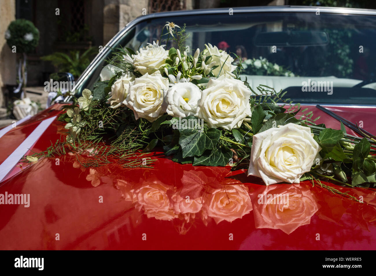 Red car with red roses hi-res stock photography and images - Alamy