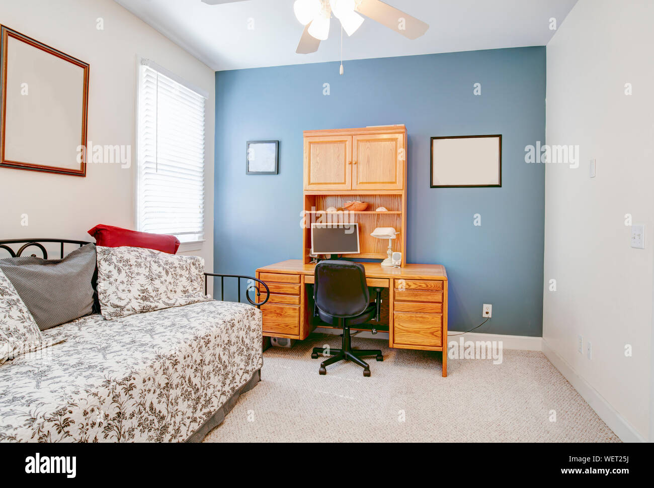 Home office or guest bedroom with desk and computer Stock Photo - Alamy